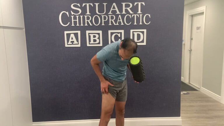 Lateral thigh foam rolling - Stuart Chiropractic